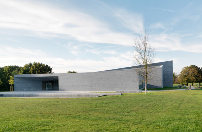 Frameweb | Stone-clad museum harmonises with its rural backdrop